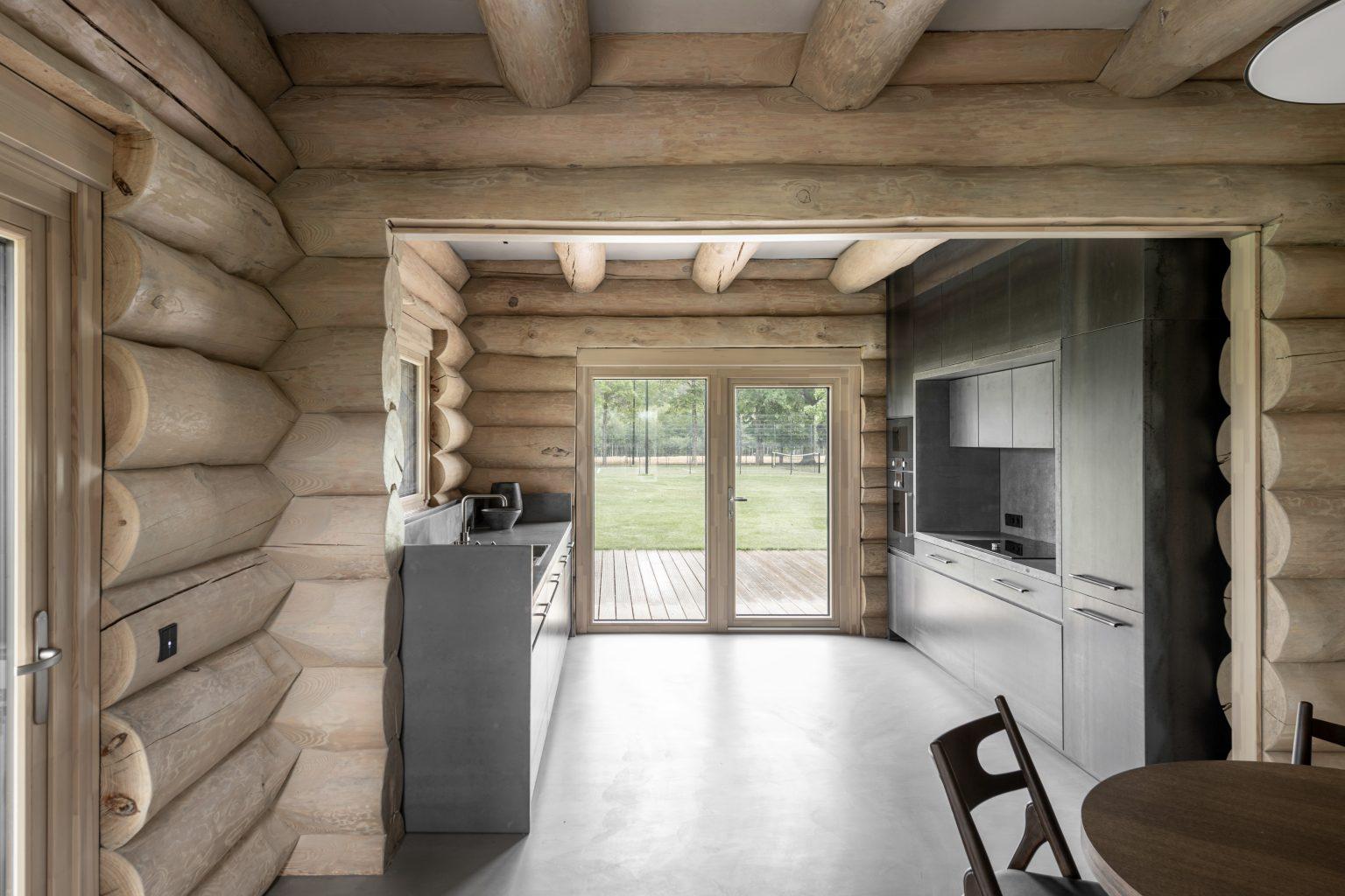 Turnstyle Designs Crafting harmony in unique log house interior ...