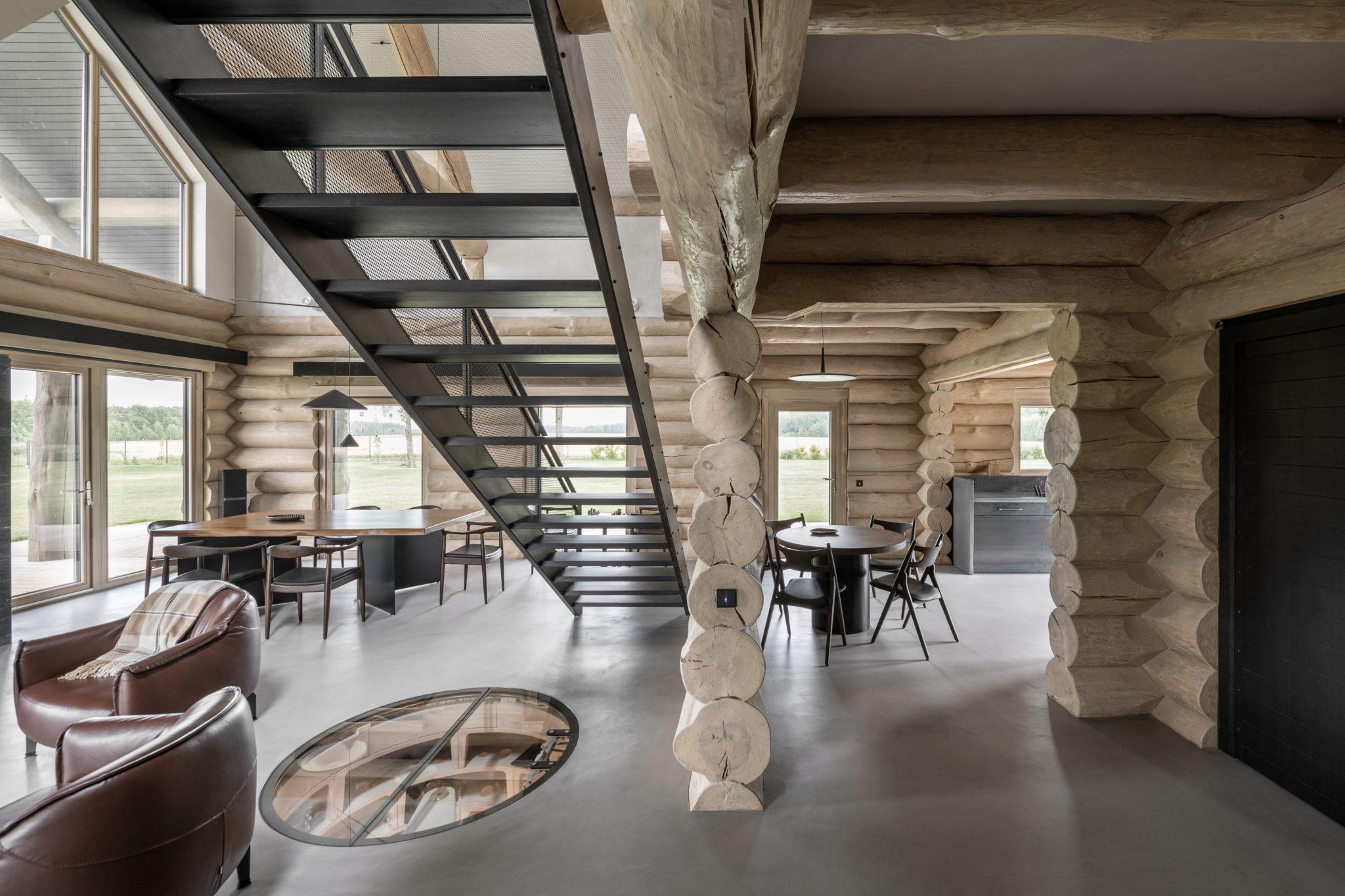 Turnstyle Designs Crafting harmony in unique log house interior ...