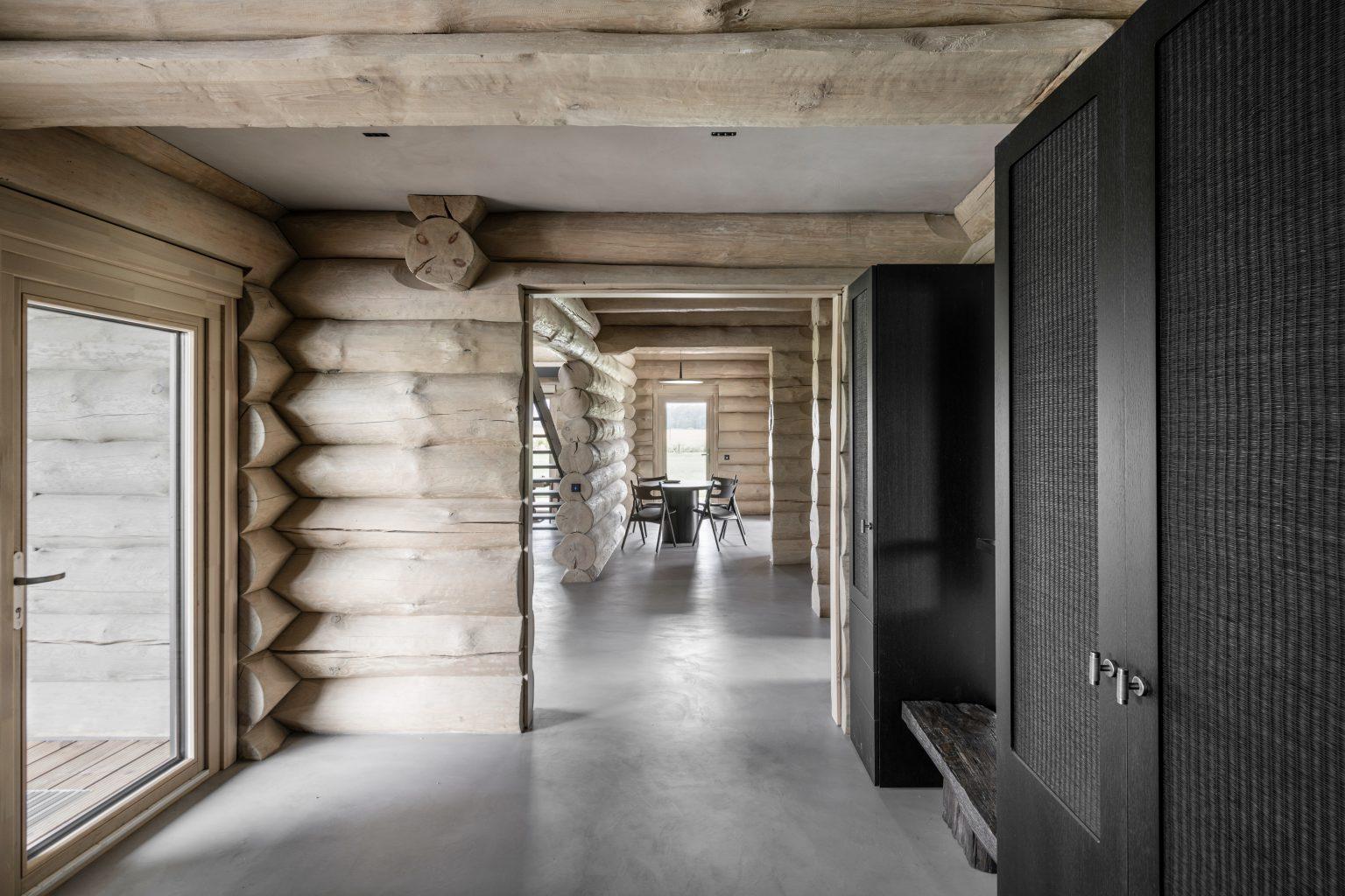 Turnstyle Designs Crafting harmony in unique log house interior ...
